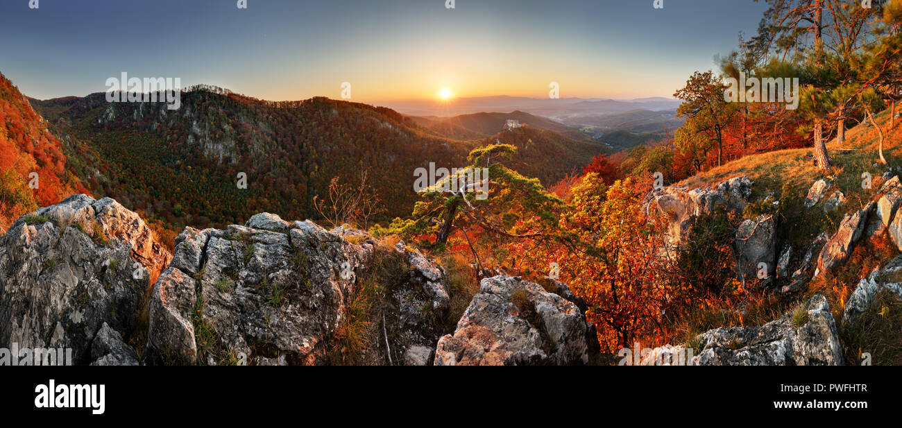 Mountain autumn landscape with colorful forest and Uhrovec castle ...