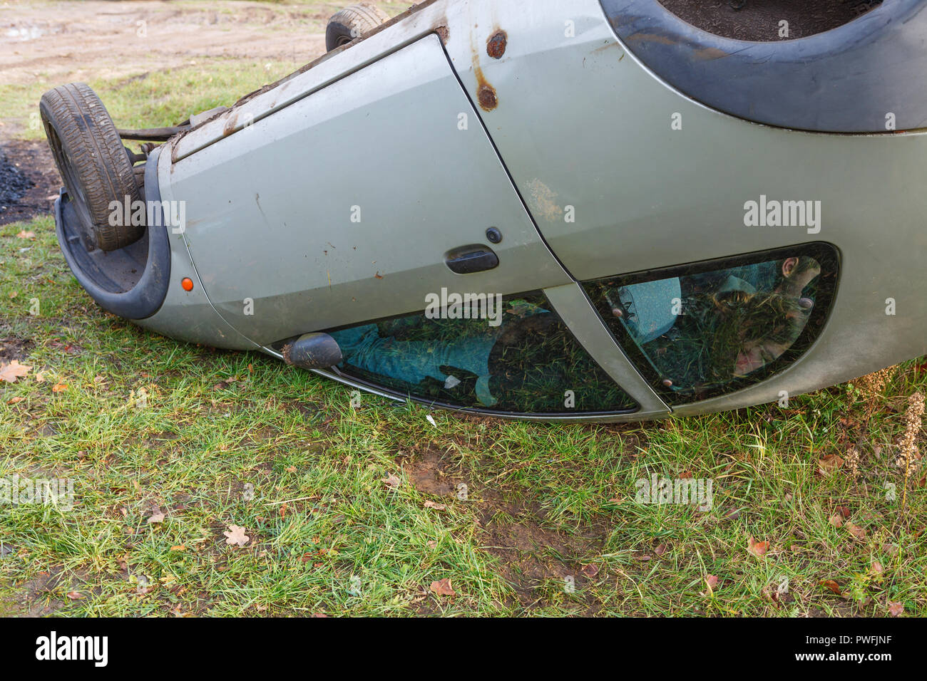 Traffic accident, car after rollover lie on the roof Stock Photo - Alamy