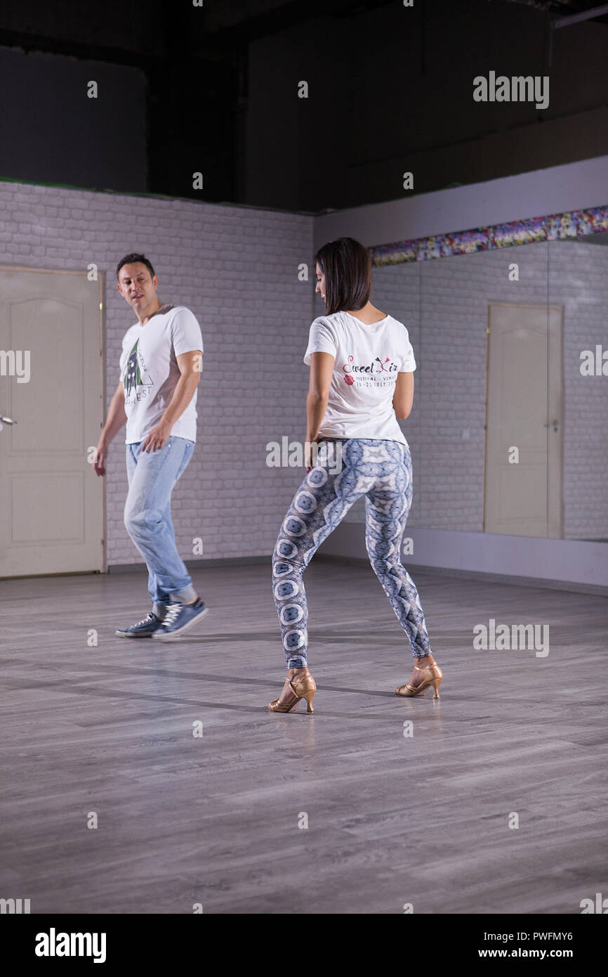 Young man enjoying dancing with her beautiful partner. Wow dancing ...