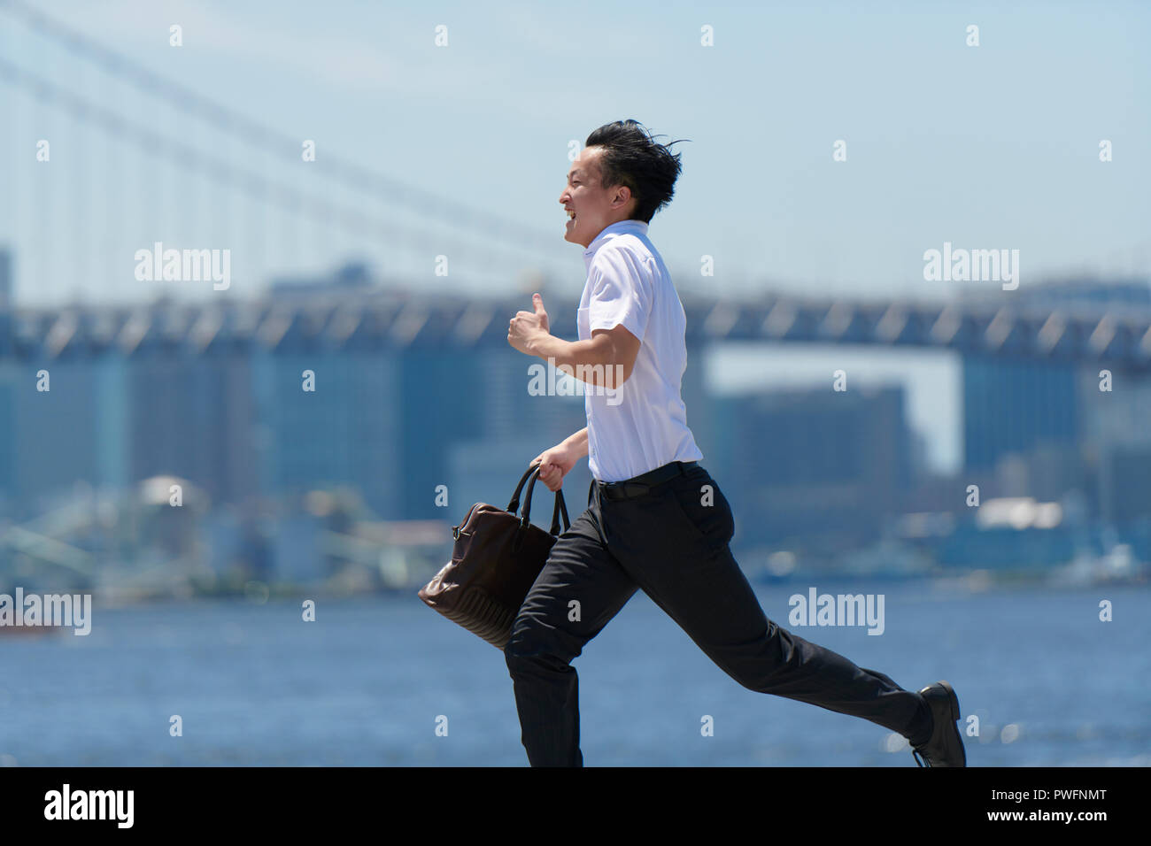Japanese man running downtown Tokyo Stock Photo - Alamy