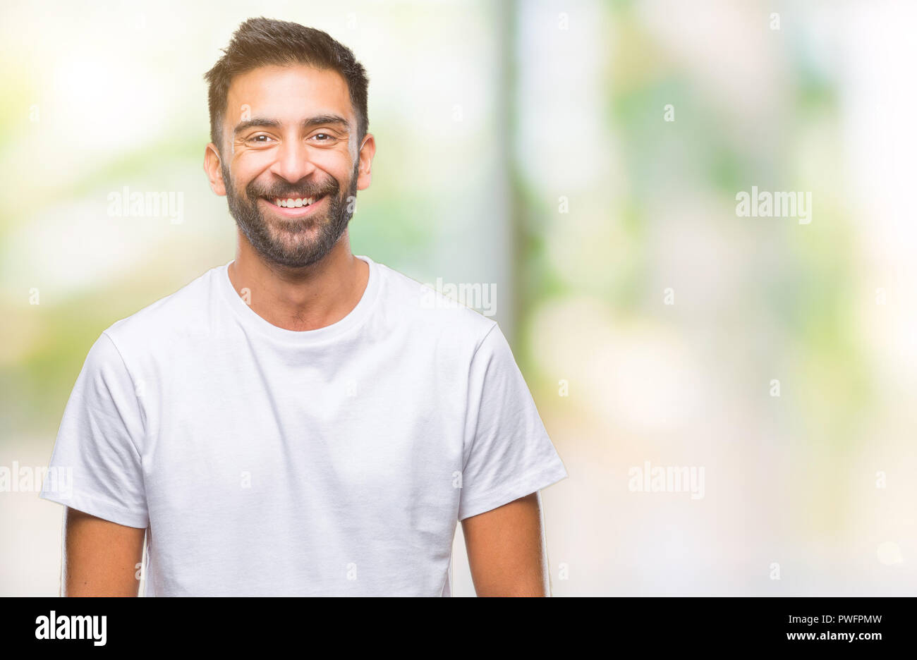 Adult hispanic man over isolated background with a happy and cool smile ...