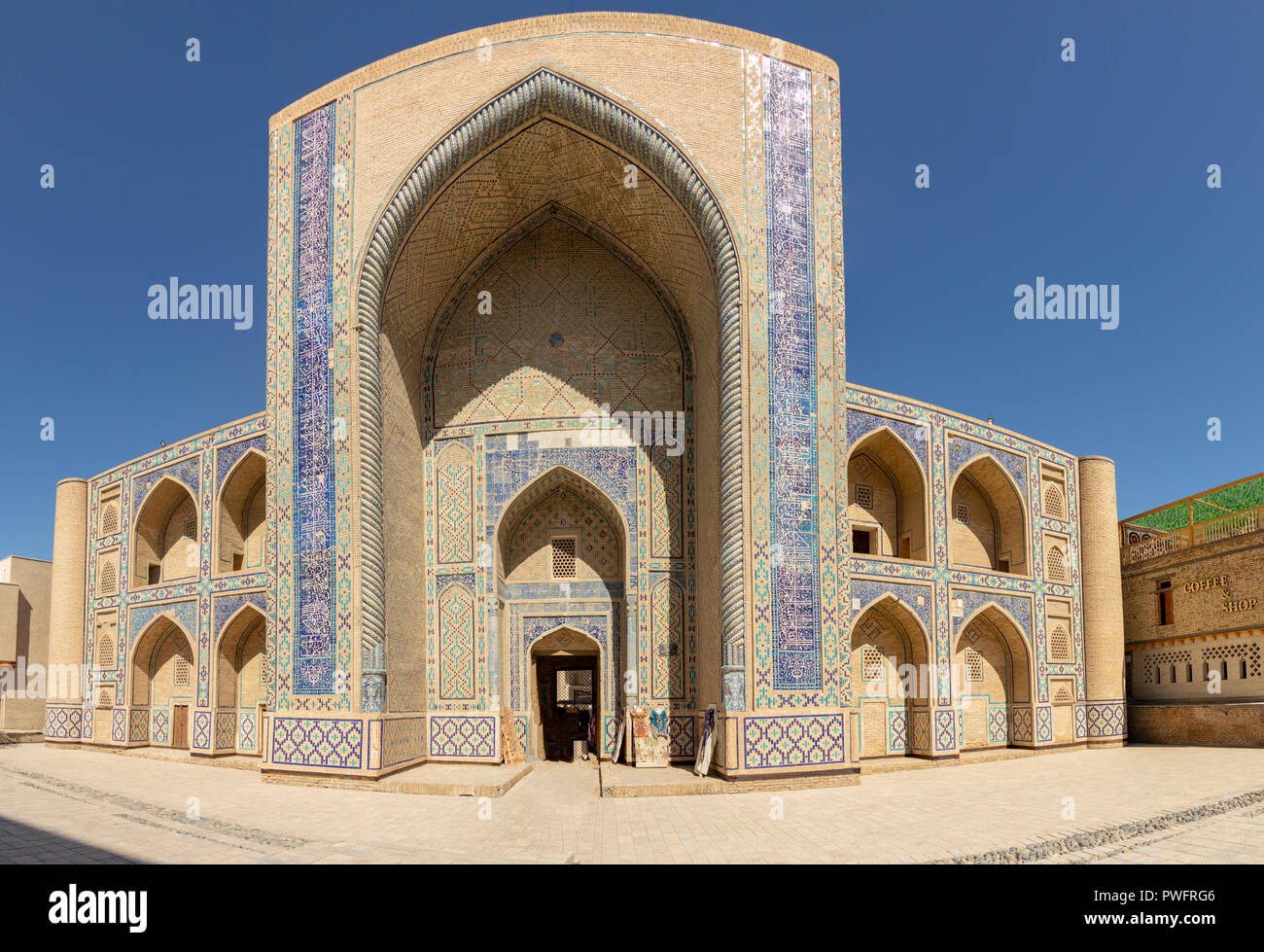 Exterior of ornate Islamic architecture with blue tile mosaics in ...