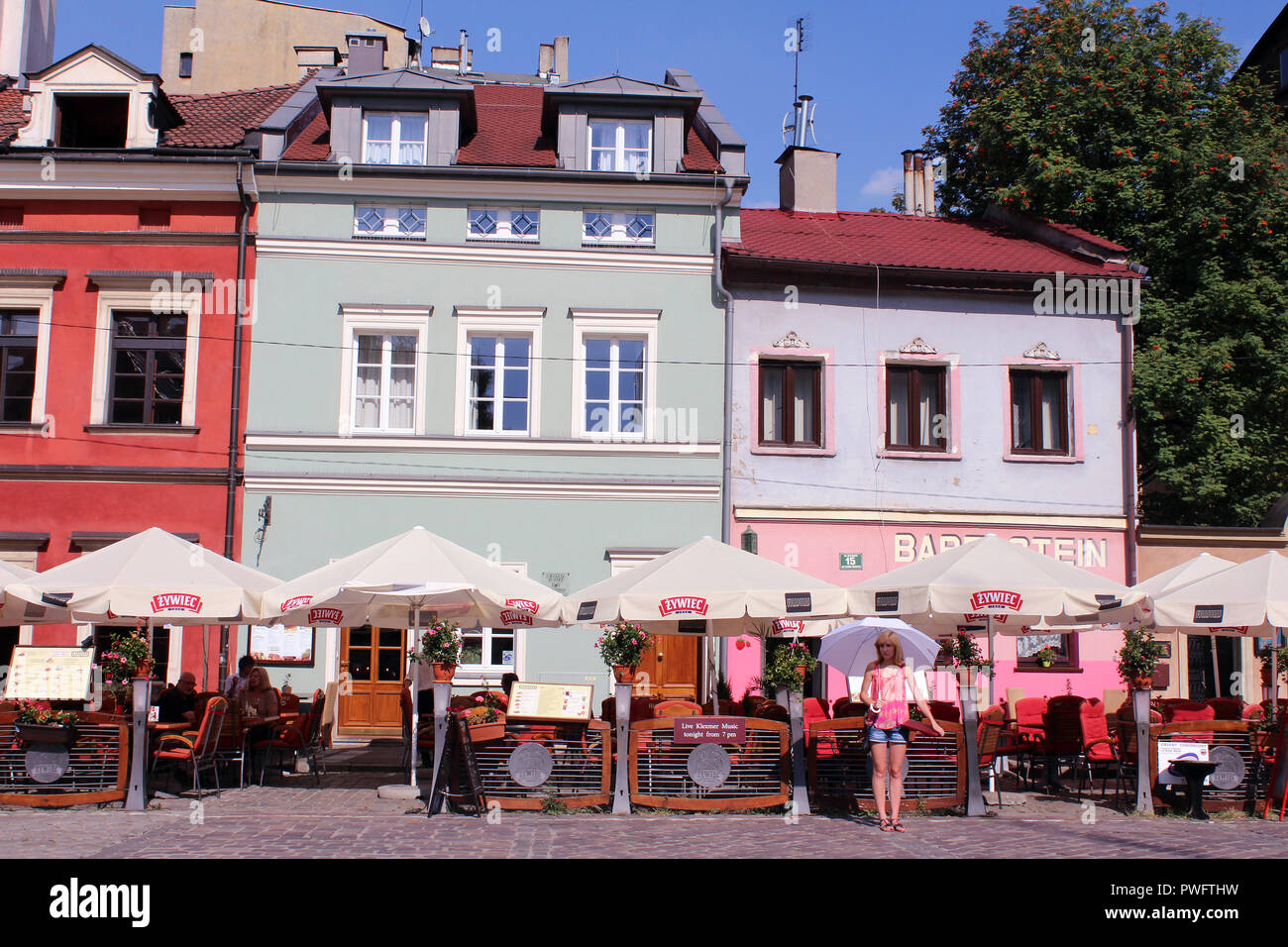 Woman in pink with umbrella in front of home of Helena Rubinstein at Ul ...