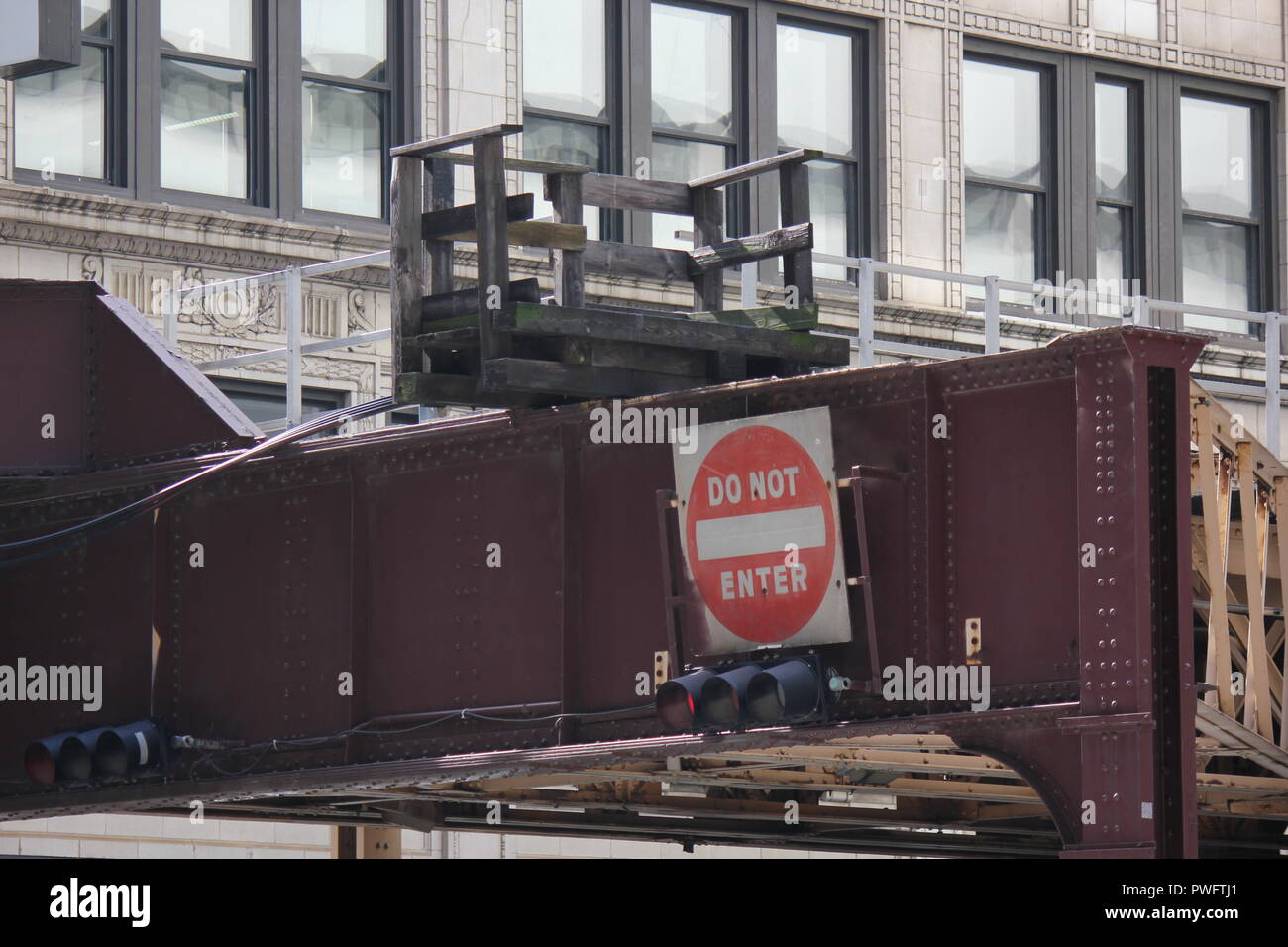 'Do Not Enter' sign hanging on the elevated train's steel structure ...