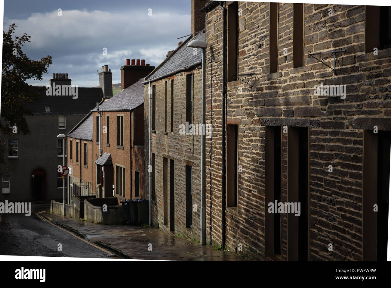Stone and brick built houses on a backstreet in Kirkwall, Scotland, UK ...