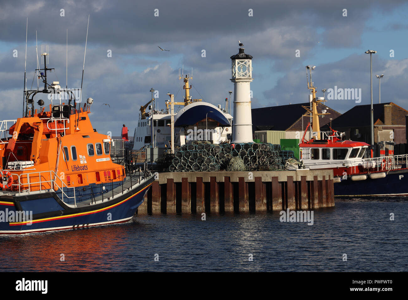 Busy Kirkwall Harbor in Kirkwall, Orkney, Scotland, on an early sunny ...