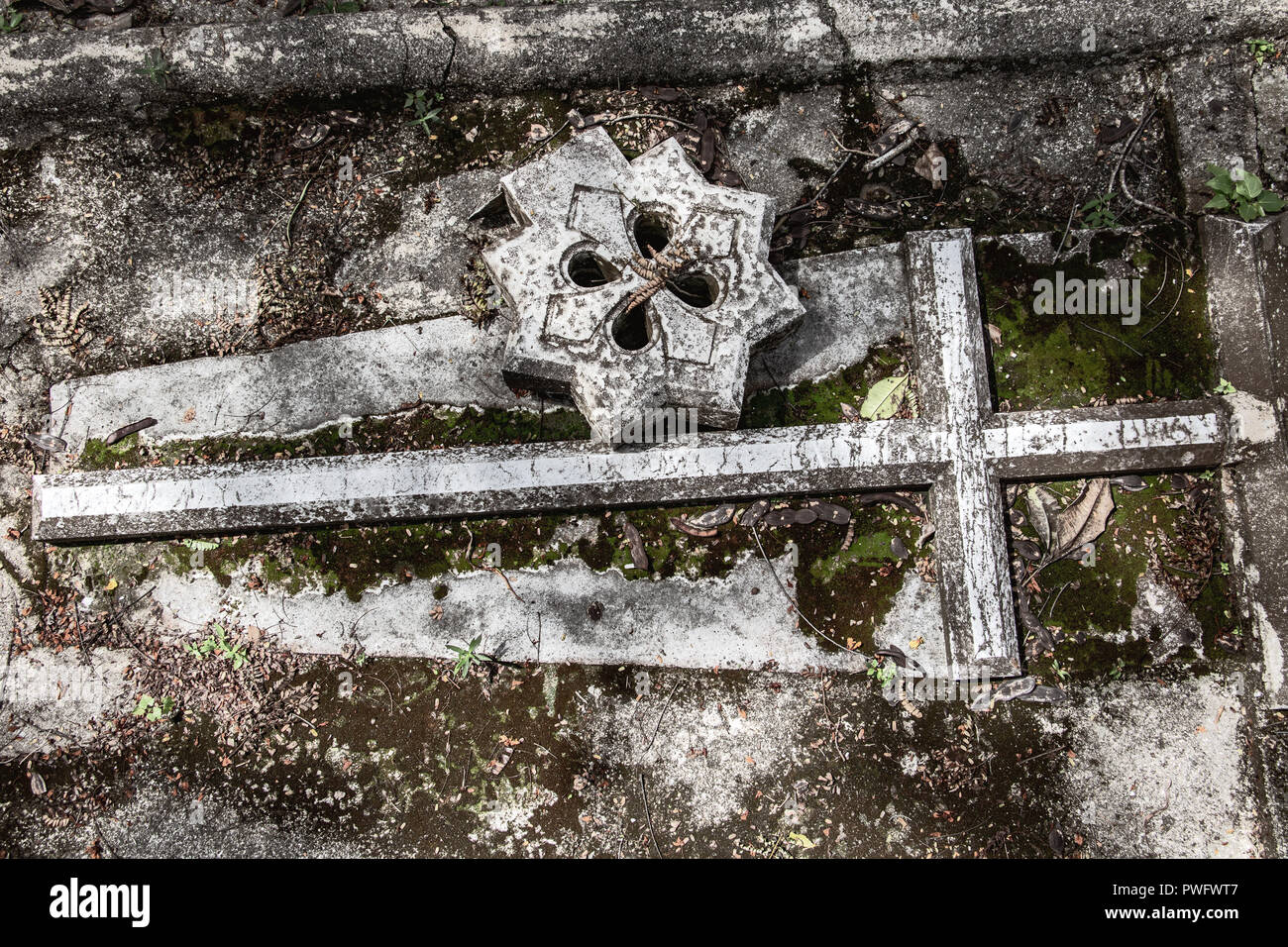 The ancient mysterious grave with cross at cemetery Stock Photo - Alamy
