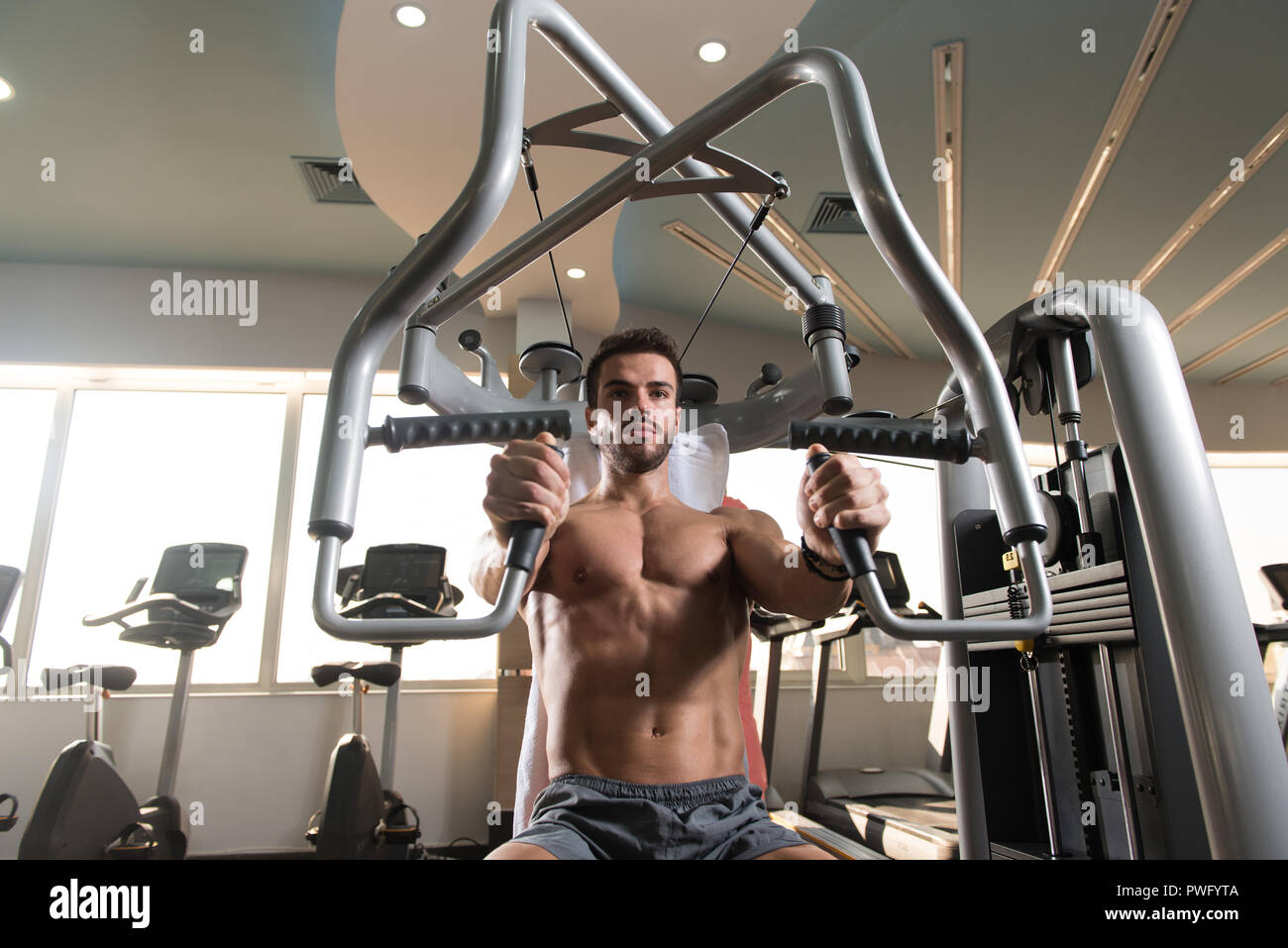 Handsome Muscular Fitness Bodybuilder Doing Heavy Weight Exercise For ...