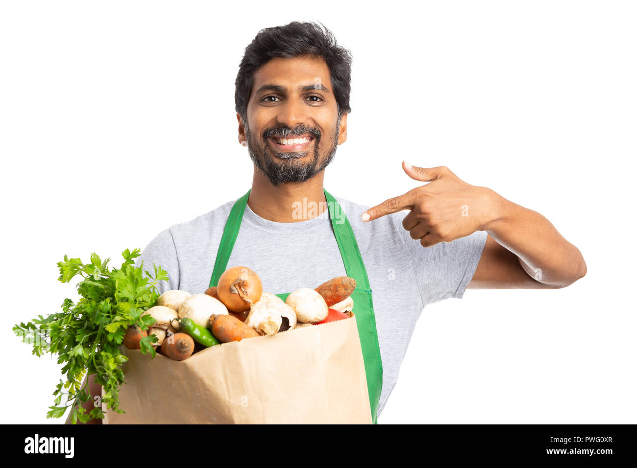 Smiling grocery store or supermarket employee presenting fresh products ...