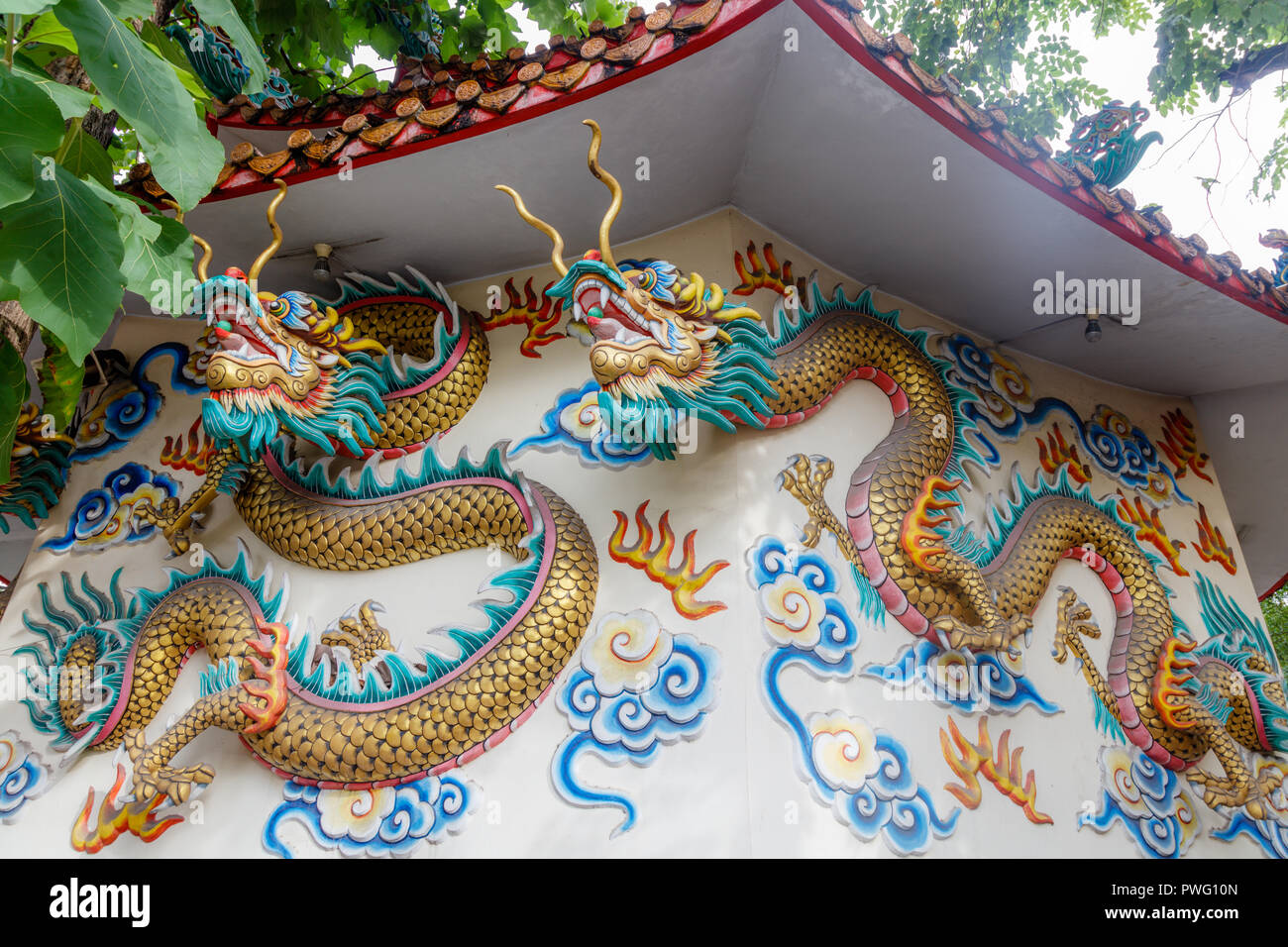 Temple wall decorated with colorful dragons. Bangkok, Thailand Stock ...