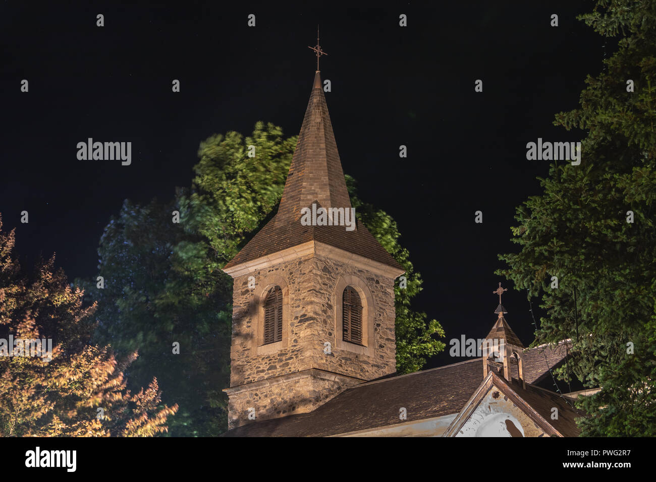 architectural detail of the Sainte Marie chapel at night in Saint Lary ...
