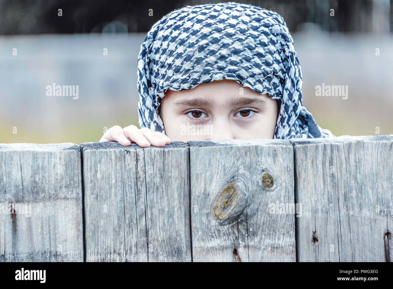 crying refugee girl from the east in a headscarf Stock Photo - Alamy