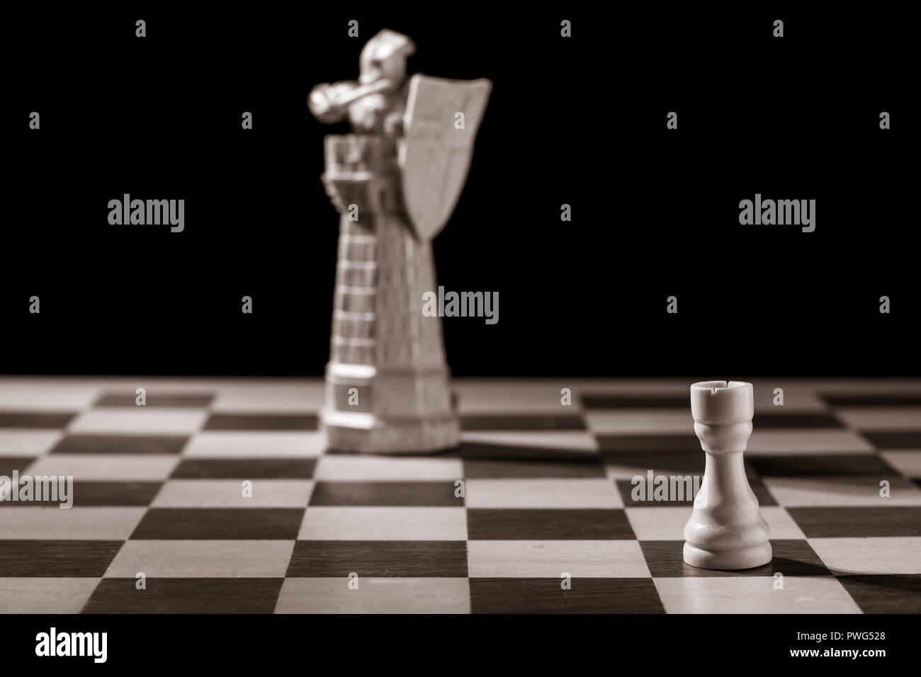 Classic white rook and the same chess piece in the form of medieval ...