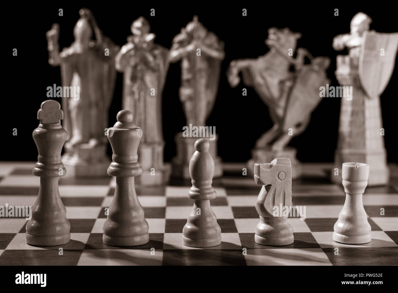 Classic white chess pieces such as king, queen, bishop, knight, rook ...