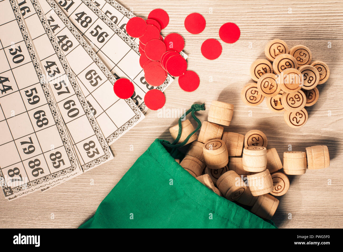 Board game lotto. Wooden lotto barrels with bag, red chips and game ...