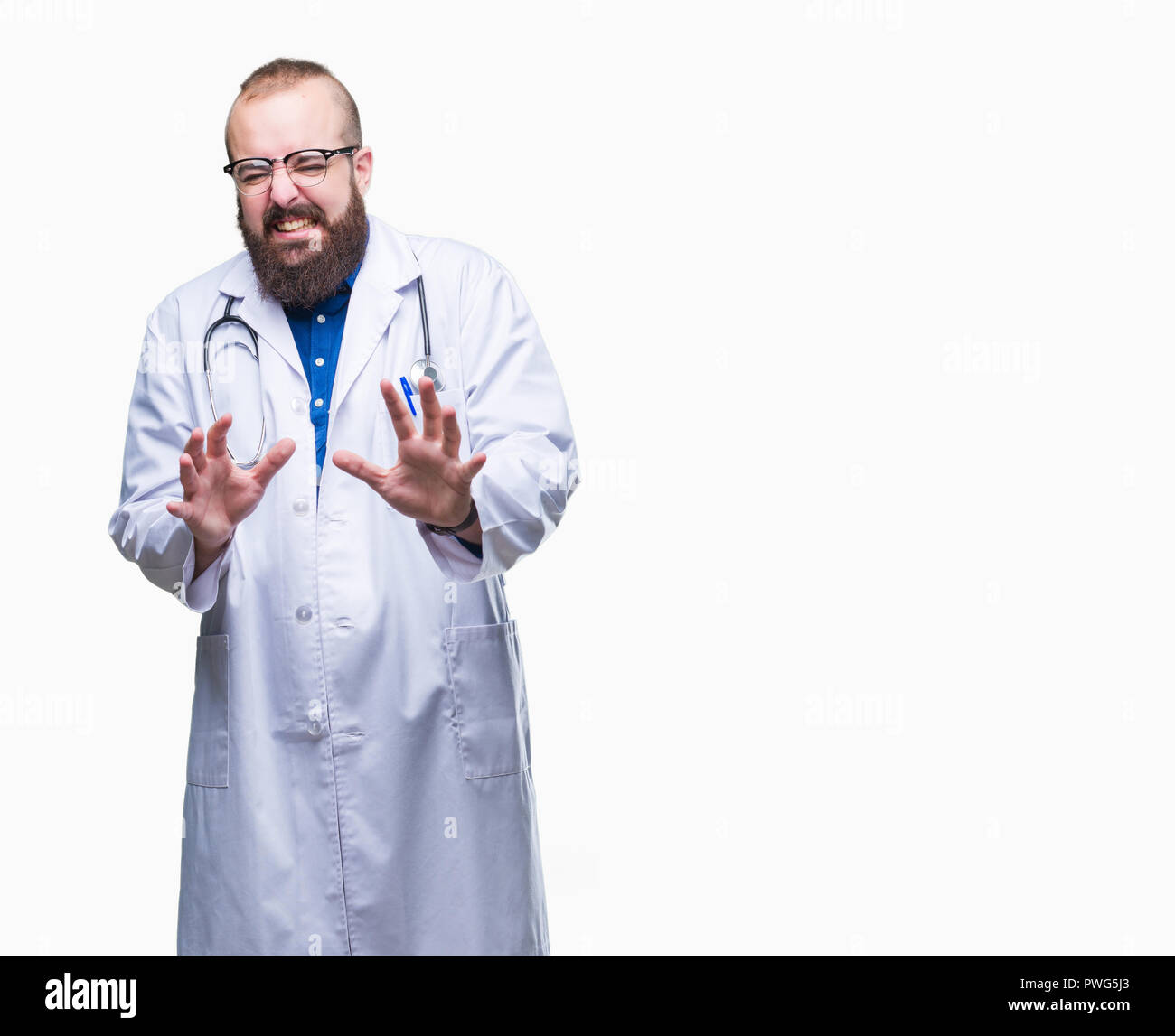 Young caucasian doctor man wearing medical white coat over isolated ...