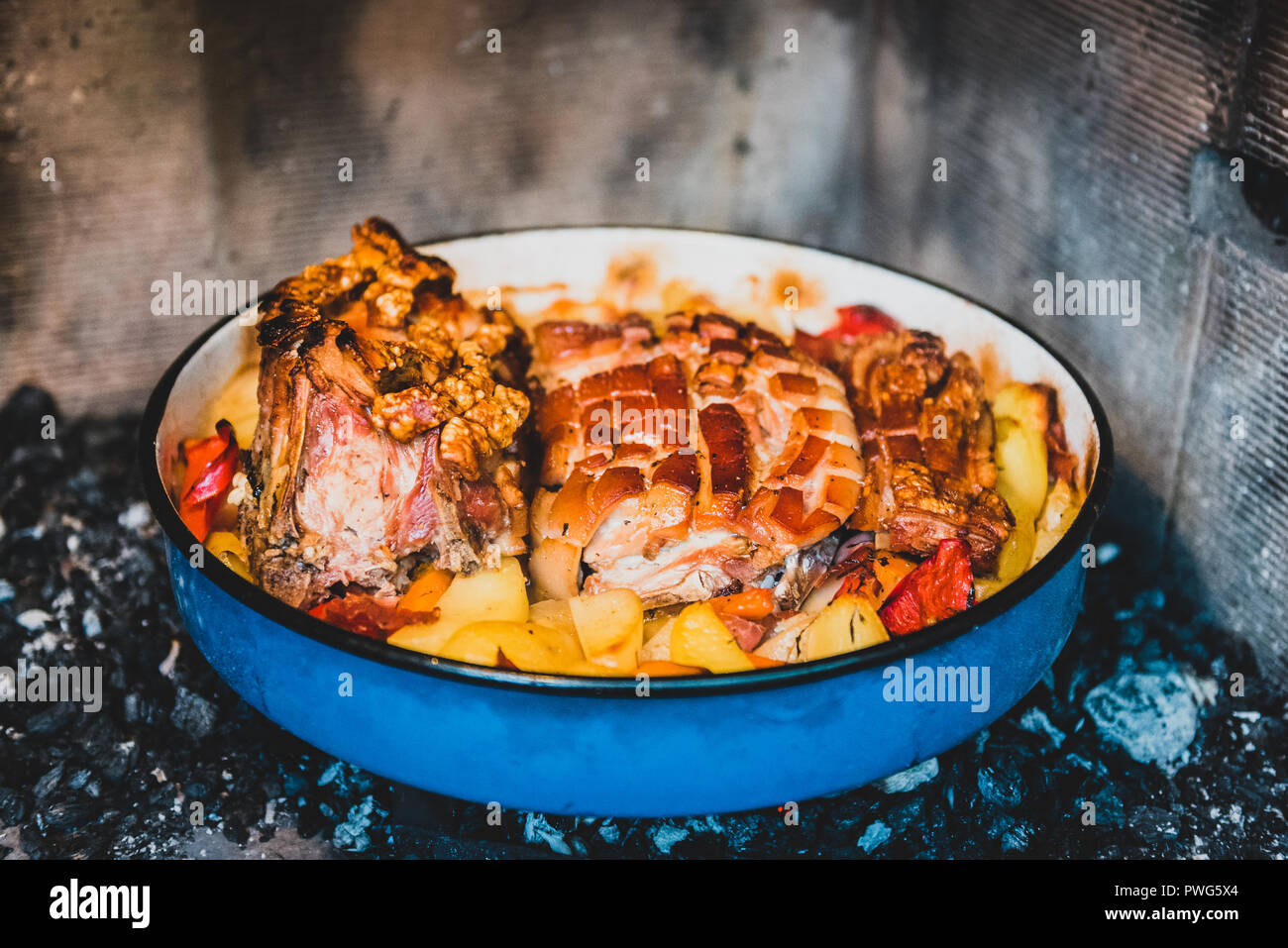 Preparing and cooking pork roast in traditional metal pot Peka. Meat ...