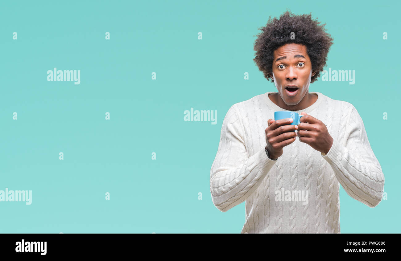 Afro american man drinking cup of coffee over isolated background ...