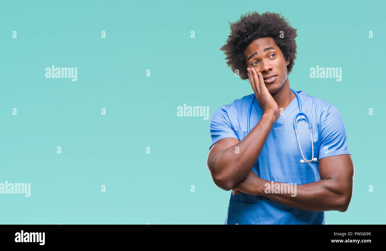 Afro american surgeon doctor man over isolated background thinking ...
