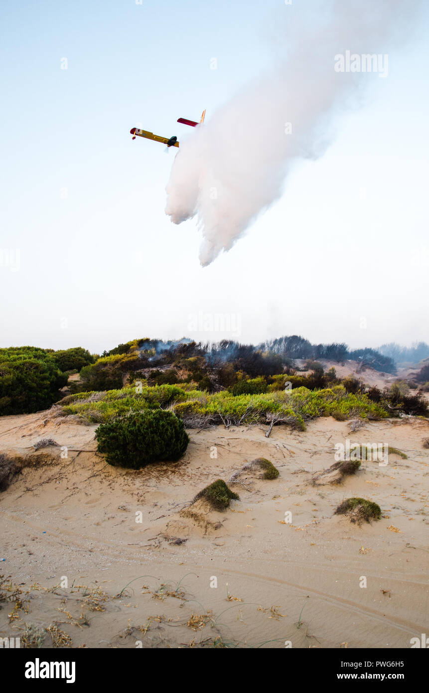 firefighting aircraft, canadair in action, throwing water into the fire ...