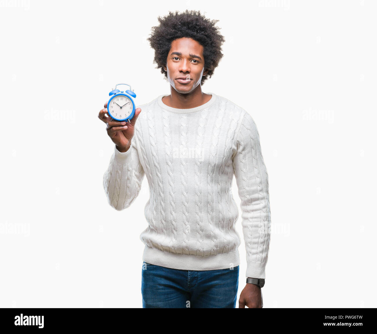 Afro american man holding vintage alarm clock over isolated background ...