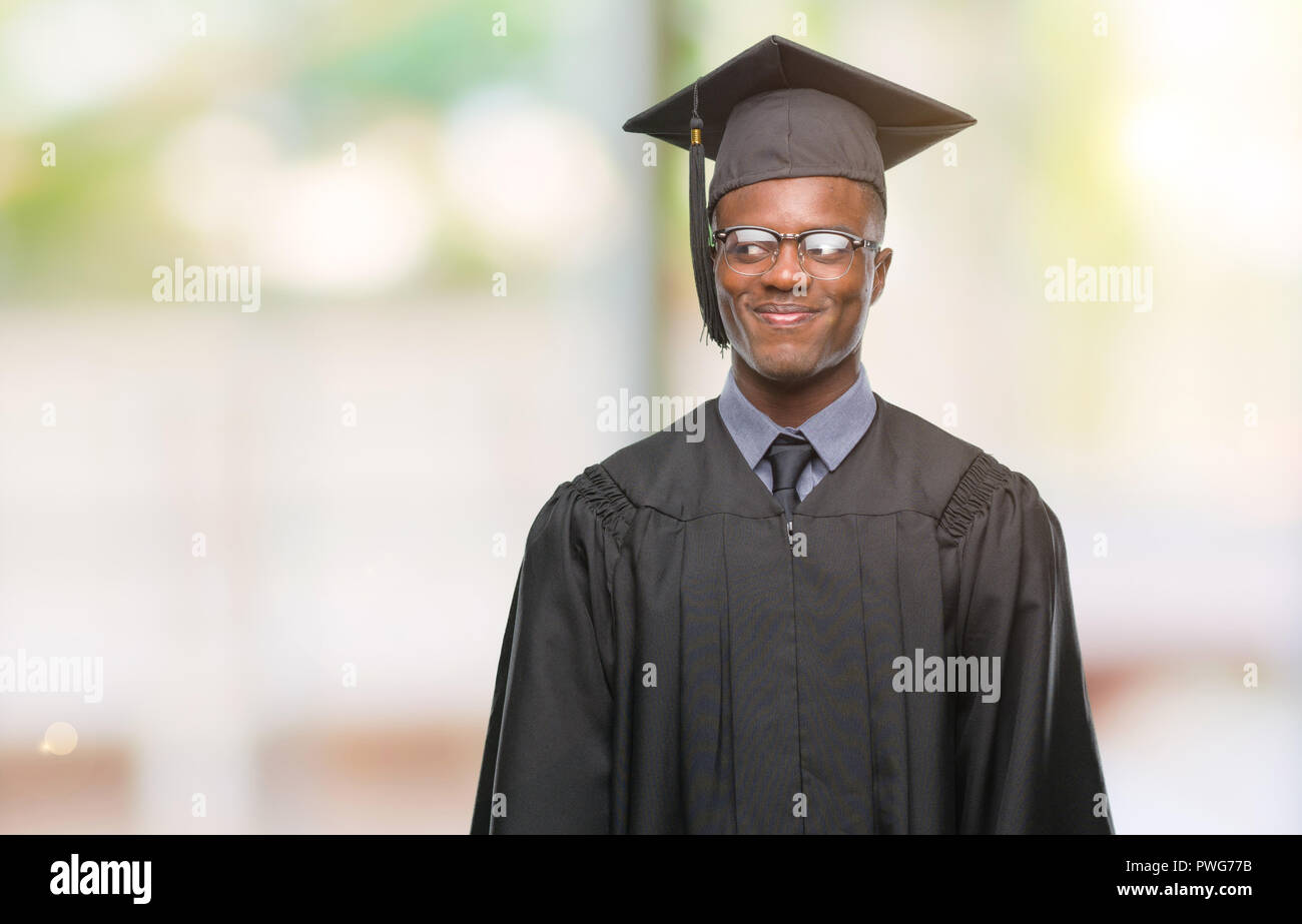 Young graduated african american man over isolated background smiling ...