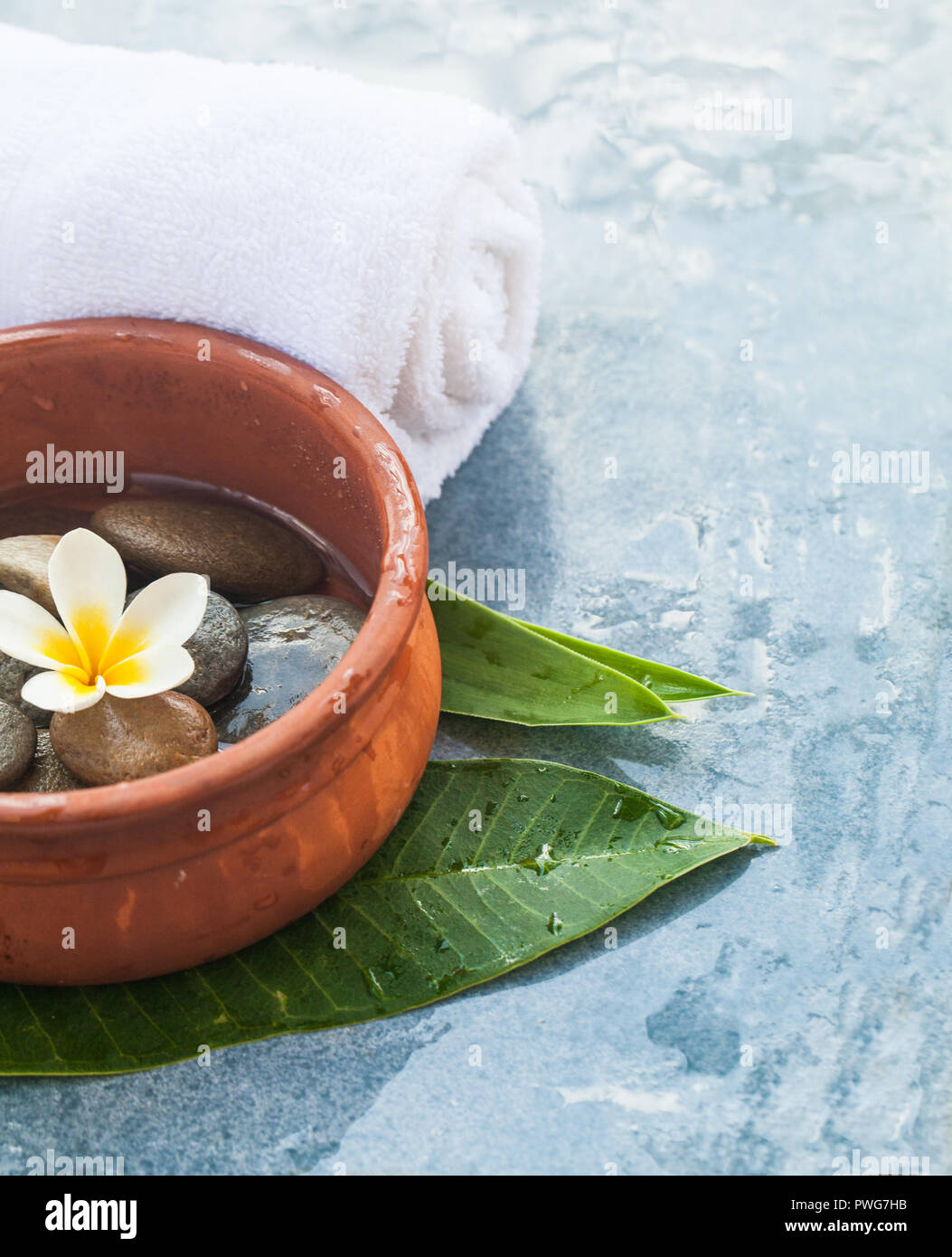 spa objects for massage treatment with sunlight on blue background ...