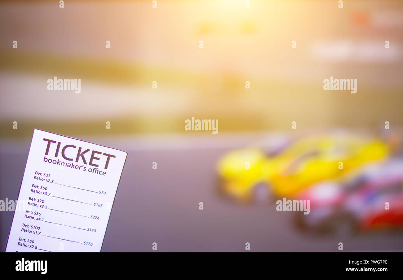 Bookmaker ticket on the background of the TV, which shows the car rally ...