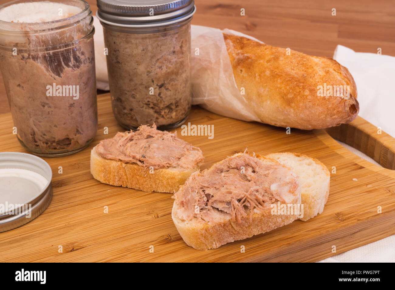 Homemade Rillettes French meat spread made of pork on a baguette bread ...