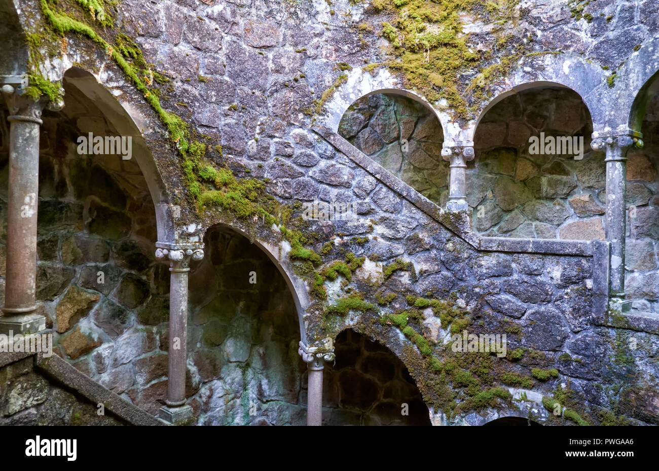 A staircase descending in a spiral along the walls of Initiation Well ...