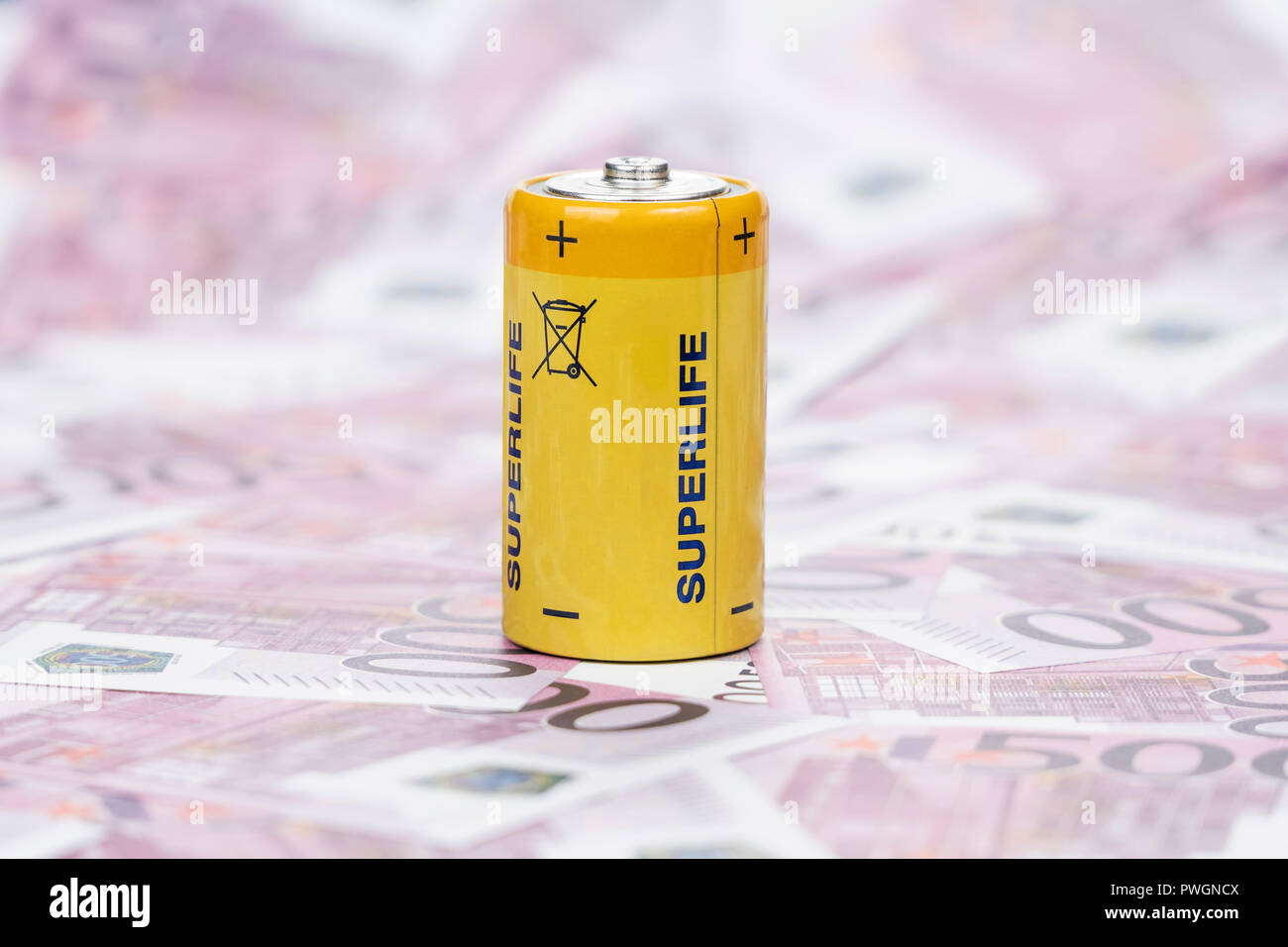 Yellow Battery stands on the money nominal value of five hundred euro ...