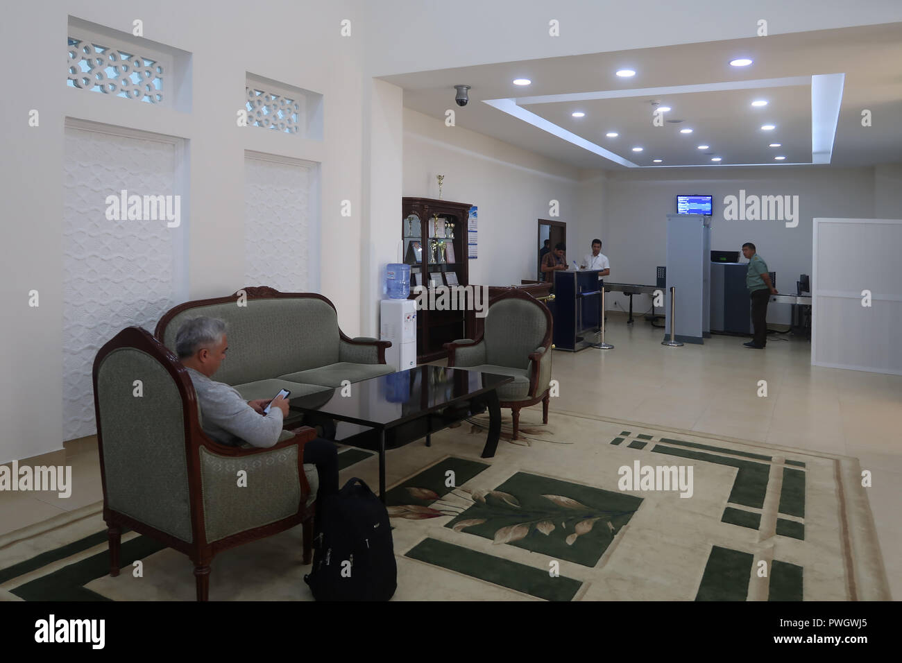 Passengers wait for their flight at the VIP lounge in Urgench ...