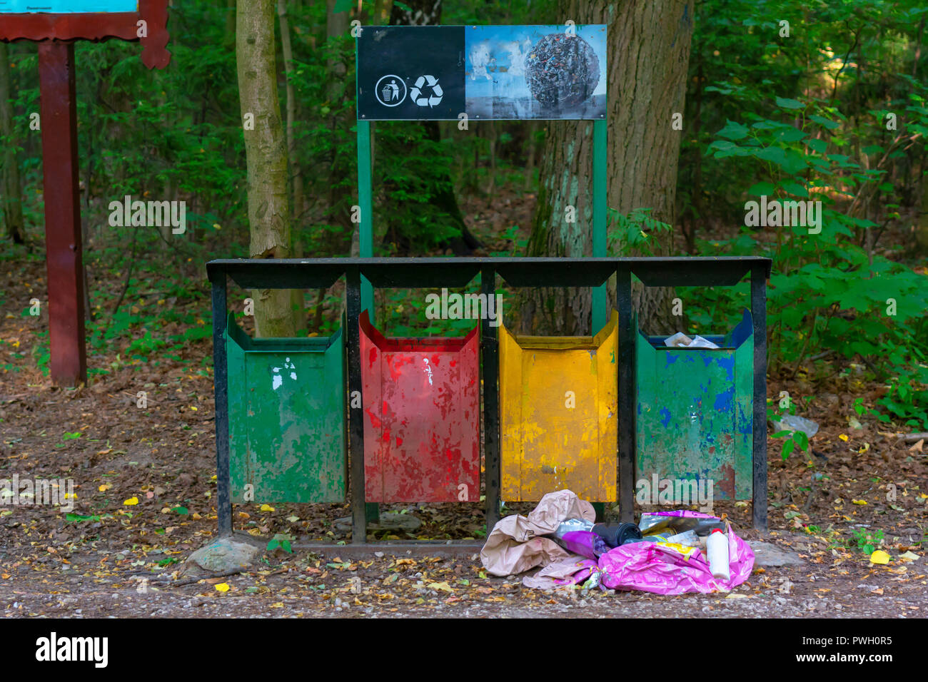 Multicolored metal litter bins Stock Photo - Alamy