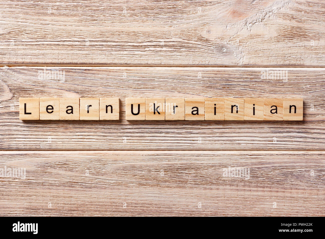 learn UKRAINIAN word written on wood block. learn UKRAINIAN text on ...