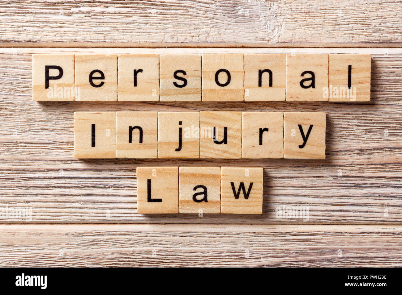personal injury law word written on wood block. personal injury law ...