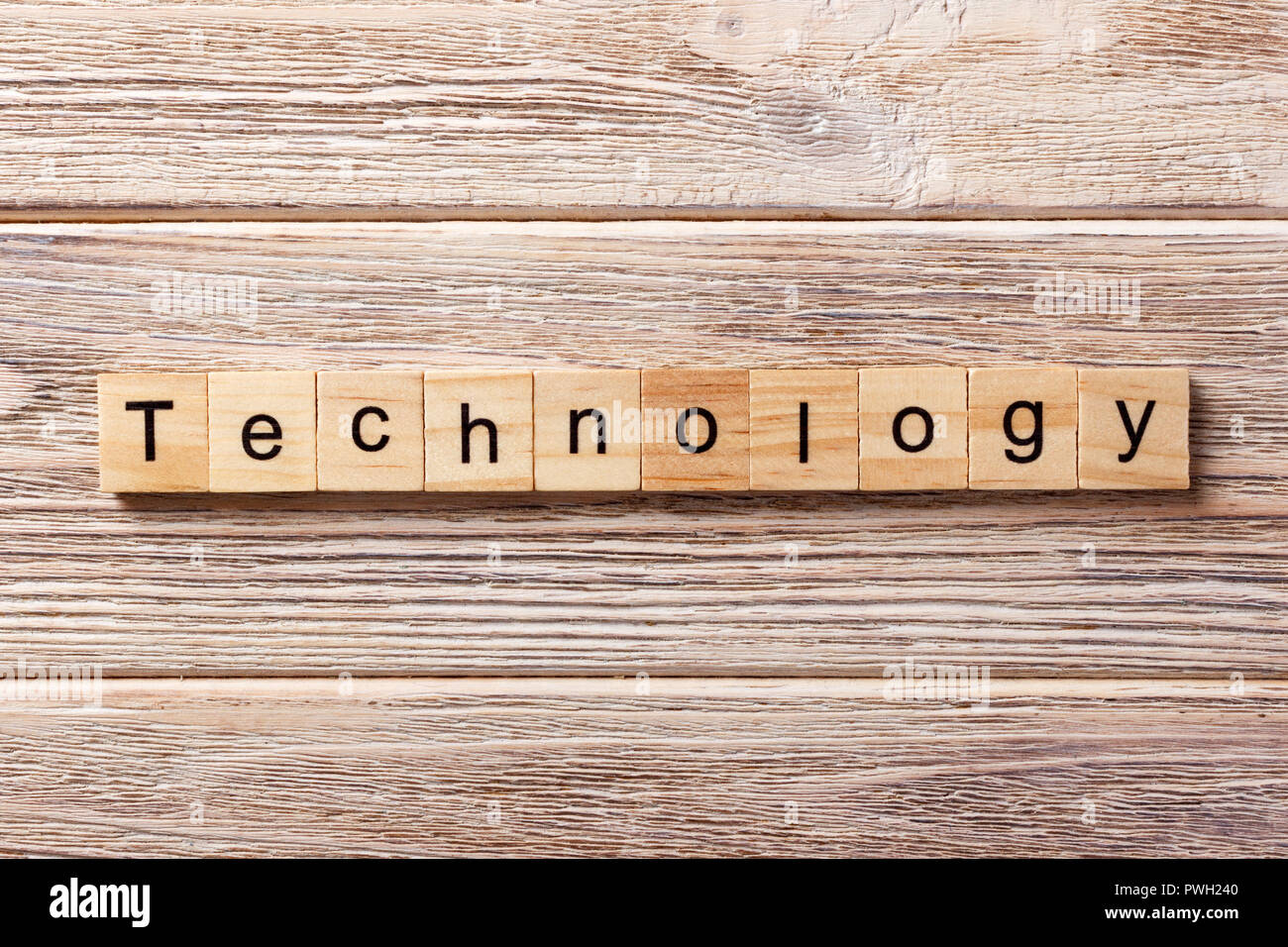 Technology word written on wood block. Technology text on table ...