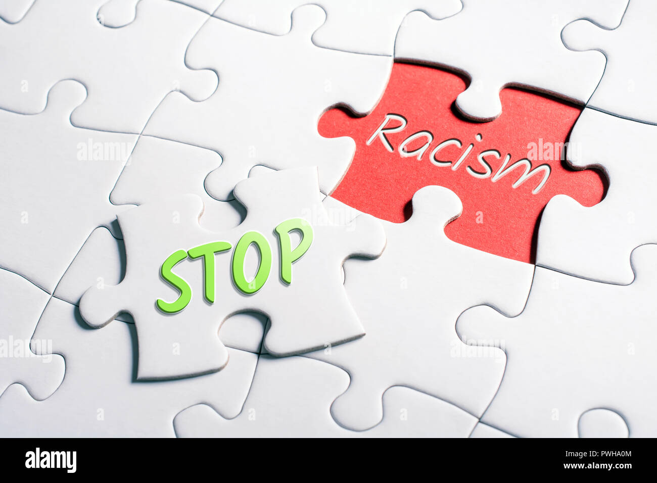 The Words Stop And Racism In Missing Piece Jigsaw Puzzle Stock Photo ...