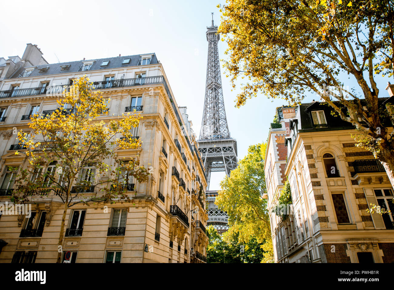 Beautiful street view with old residential buildings and Eiffel tower ...