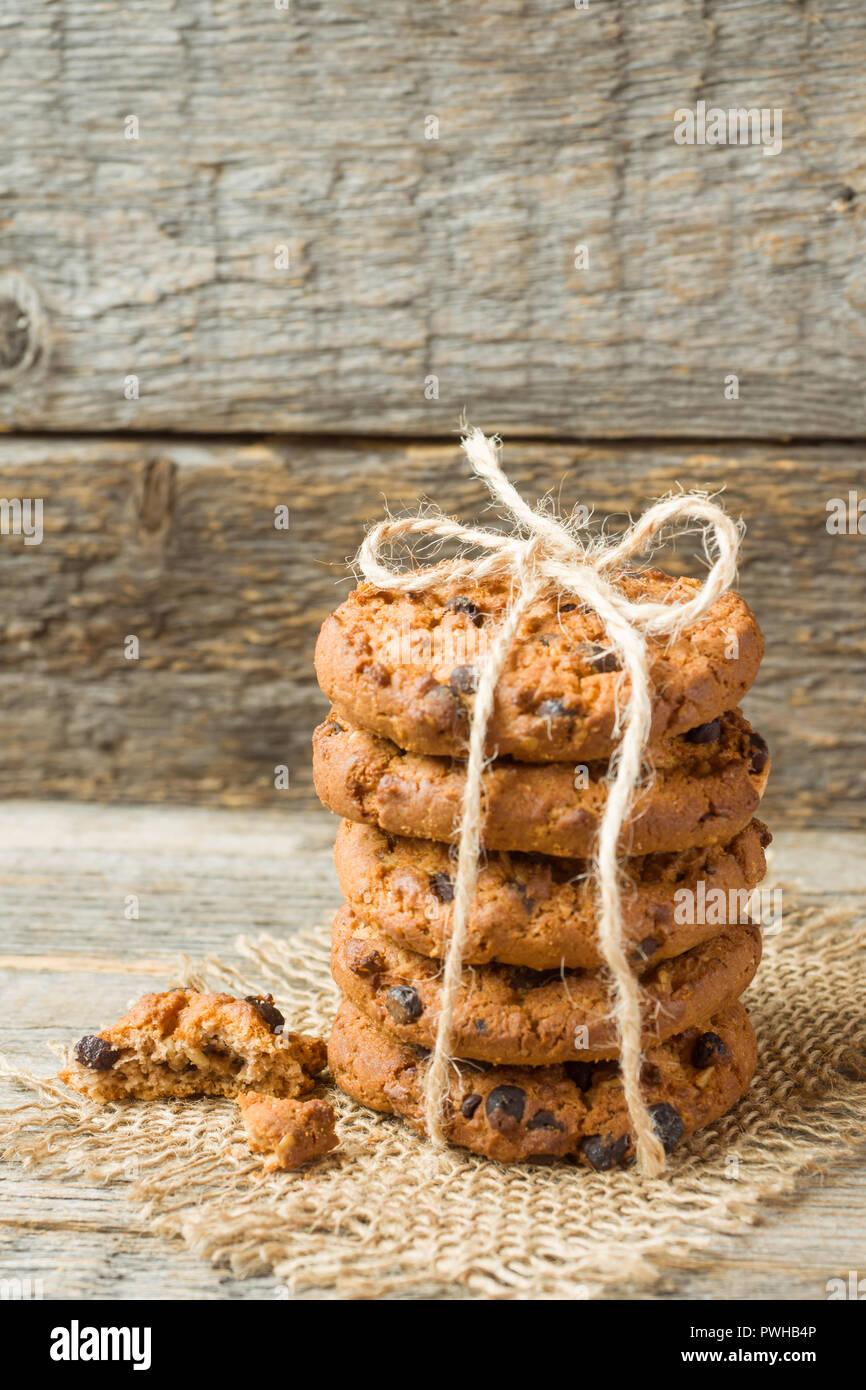Homemade cookies with chocolate thread tied on a wooden table Stock ...