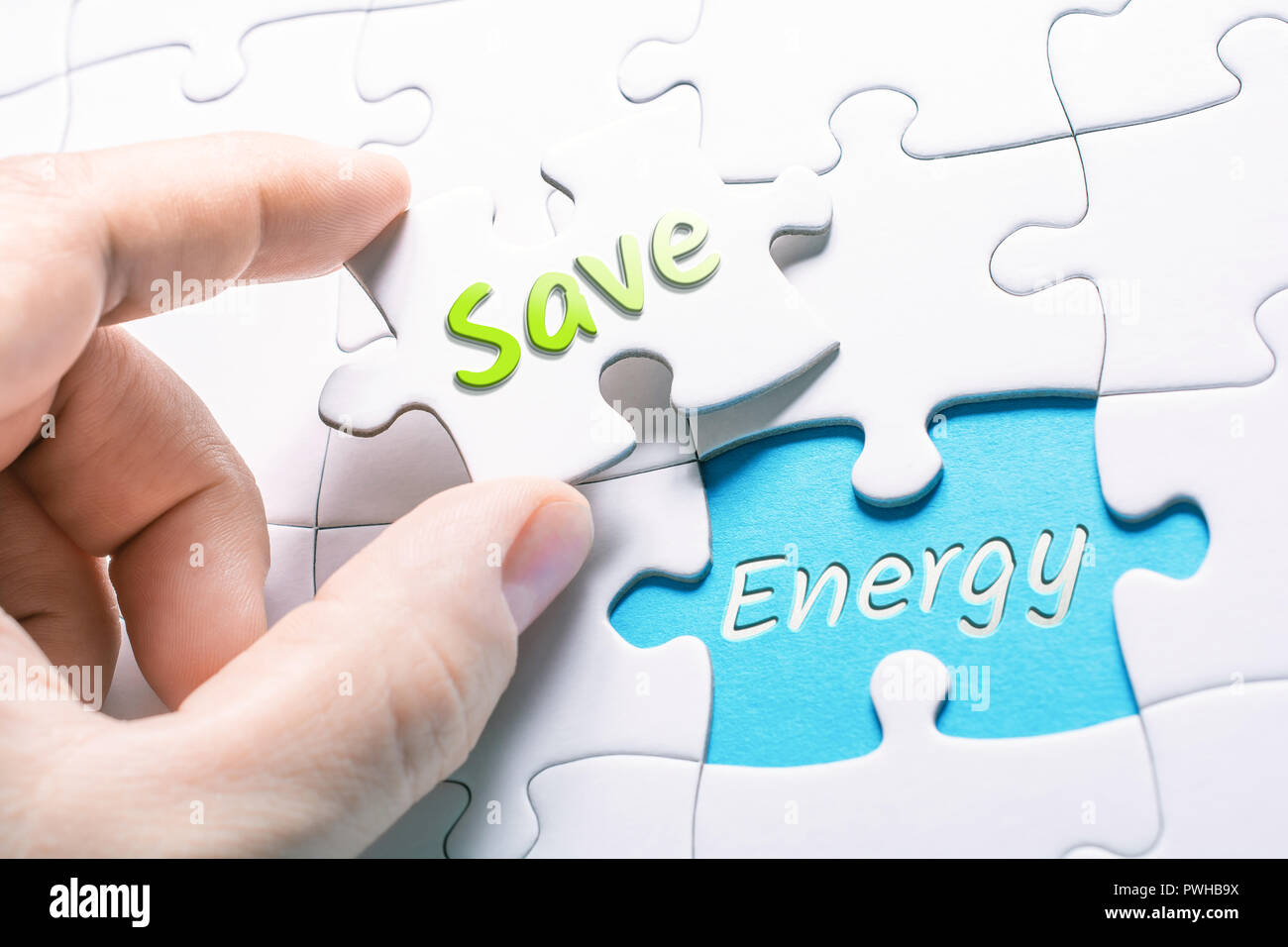 The Words Save And Energy In Missing Piece Jigsaw Puzzle Stock Photo ...