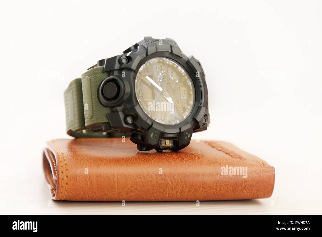 Picture of black wrist watch and wallet for men on white background ...
