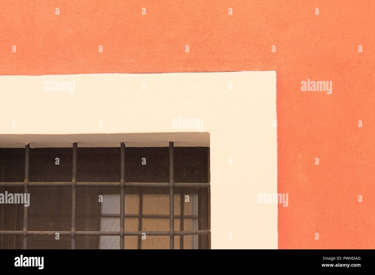 Window details with gratings of an orange house wall - Architectural ...