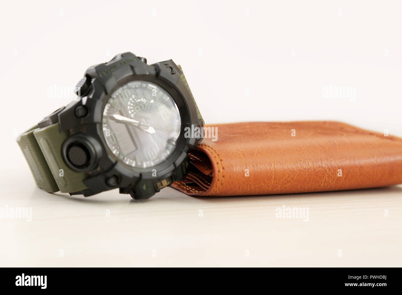 Picture of black wrist watch and wallet on white background Stock Photo ...