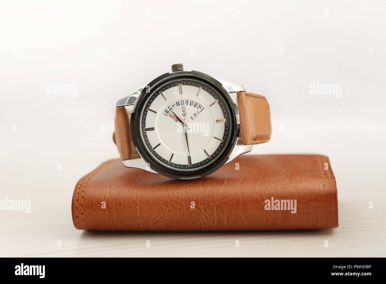 Picture of wrist watch and wallet on white background Stock Photo - Alamy