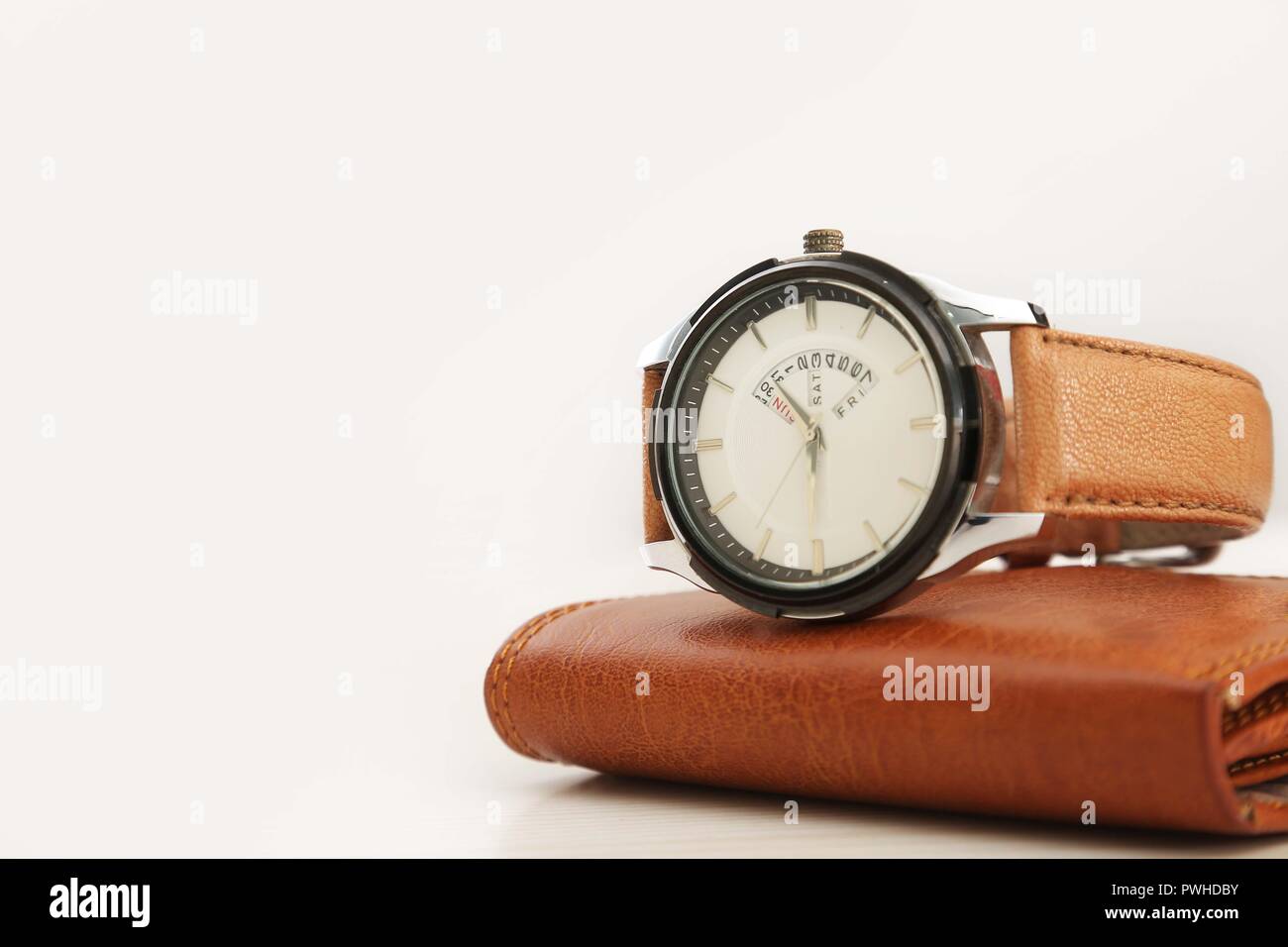 Wrist watch and wallet for men on white background Stock Photo - Alamy