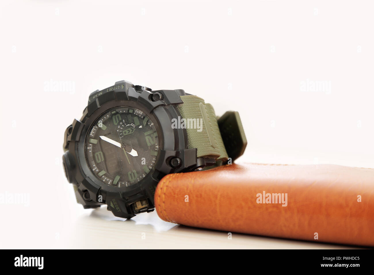 Black wrist watch and wallet for men on white background Stock Photo ...