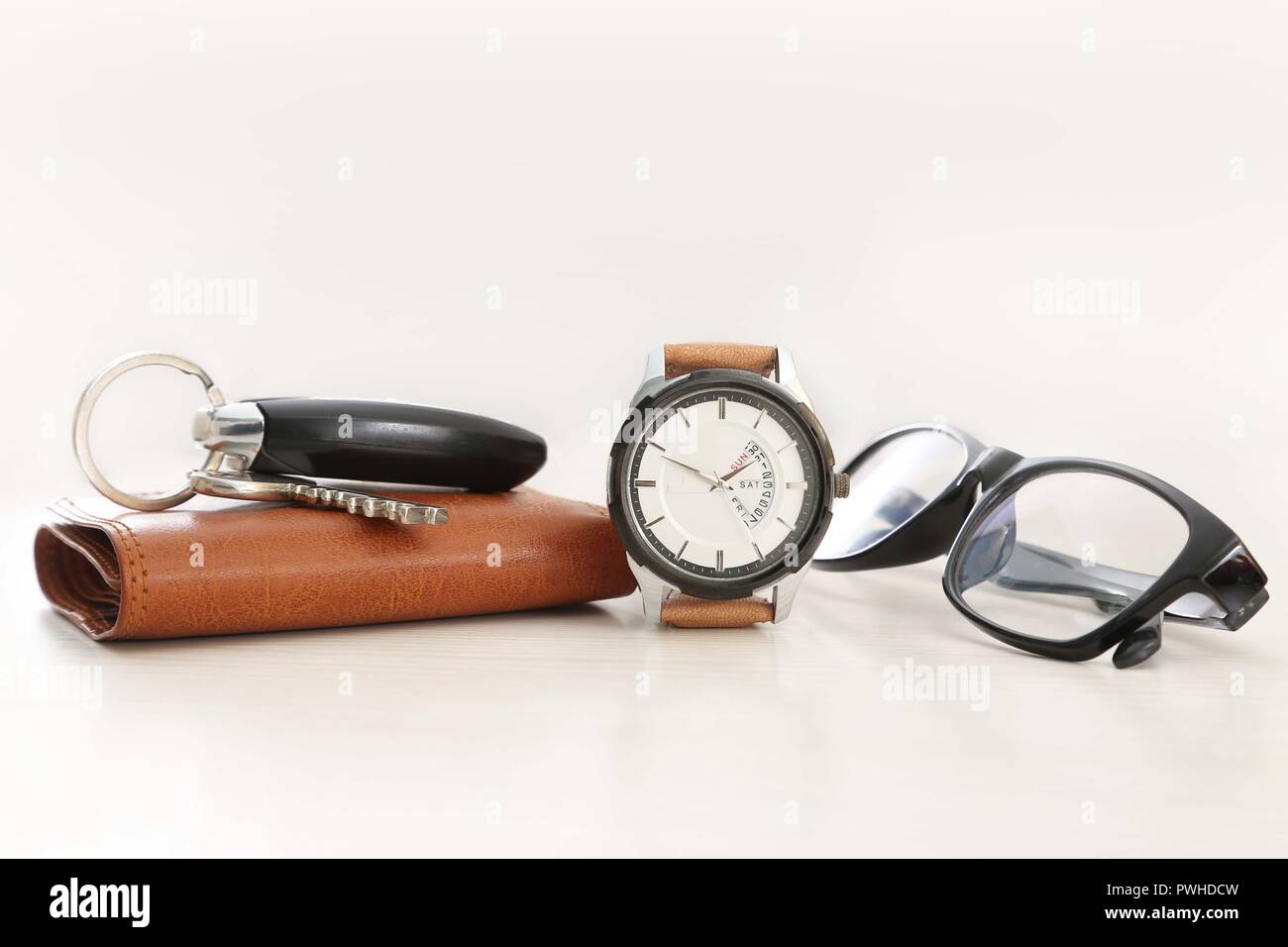 Picture of watch, car key, glasses and wallet. Isolated on white ...