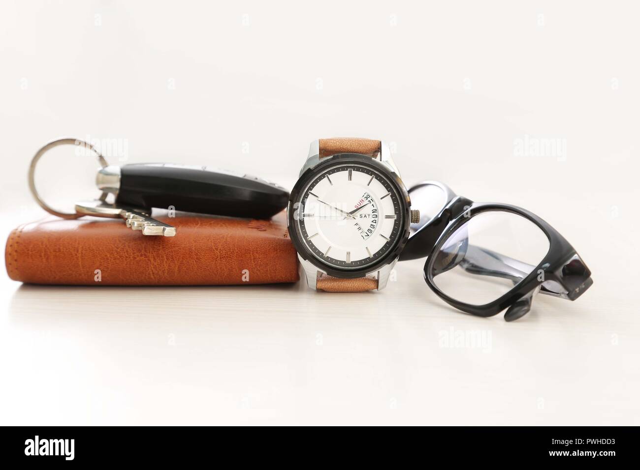 Picture of watch, car key, glasses and wallet. Isolated on white ...