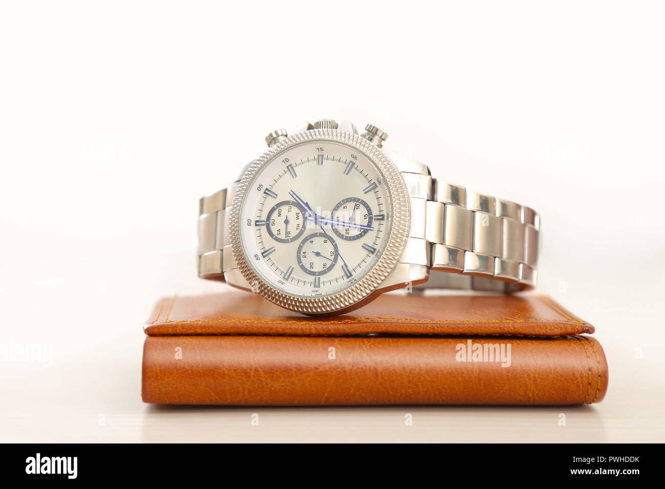 Picture of wallet and wrist watch. Isolated on white background Stock ...