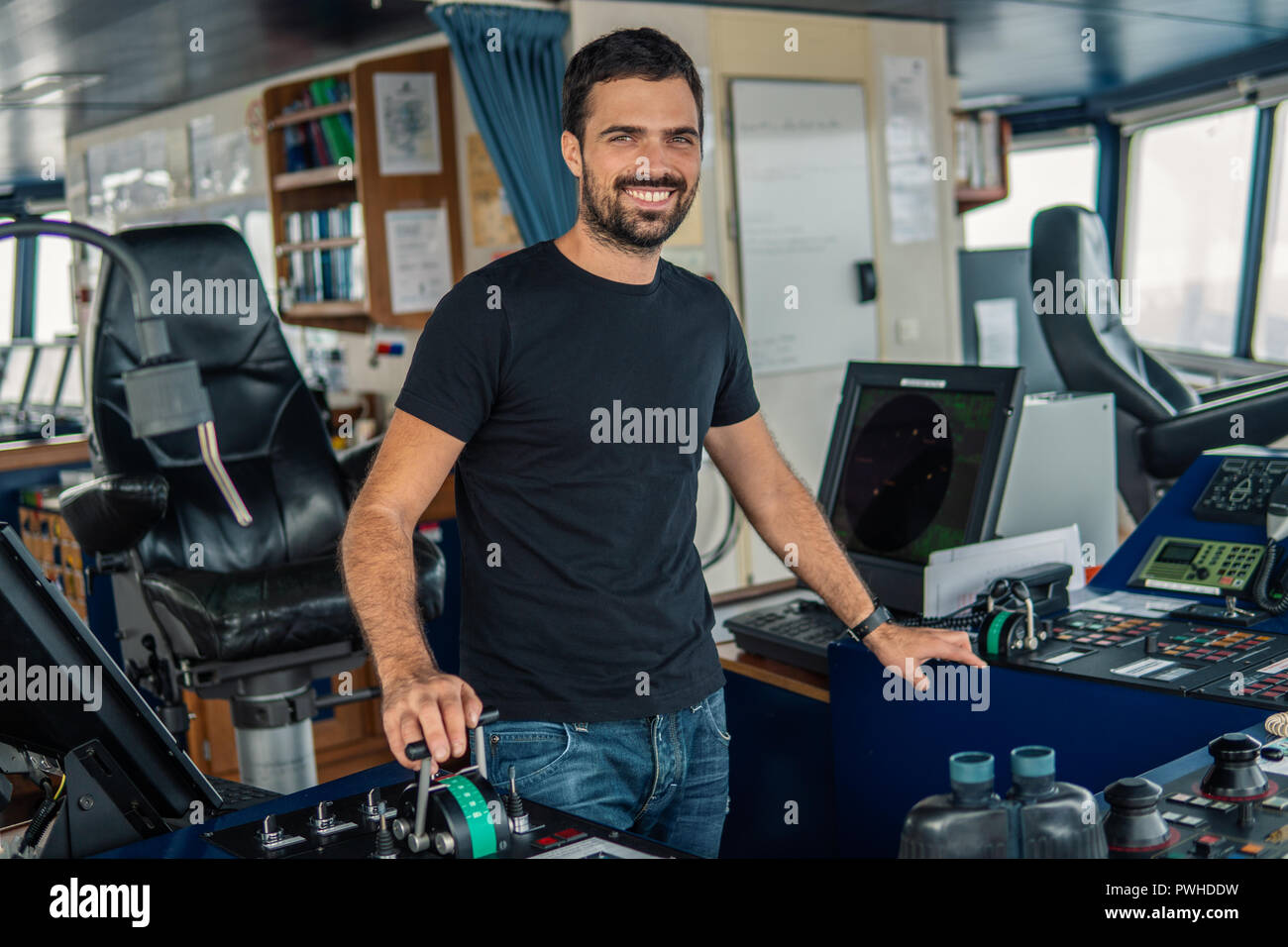 Marine navigational officer is maneuvering ship or vessel Stock Photo ...